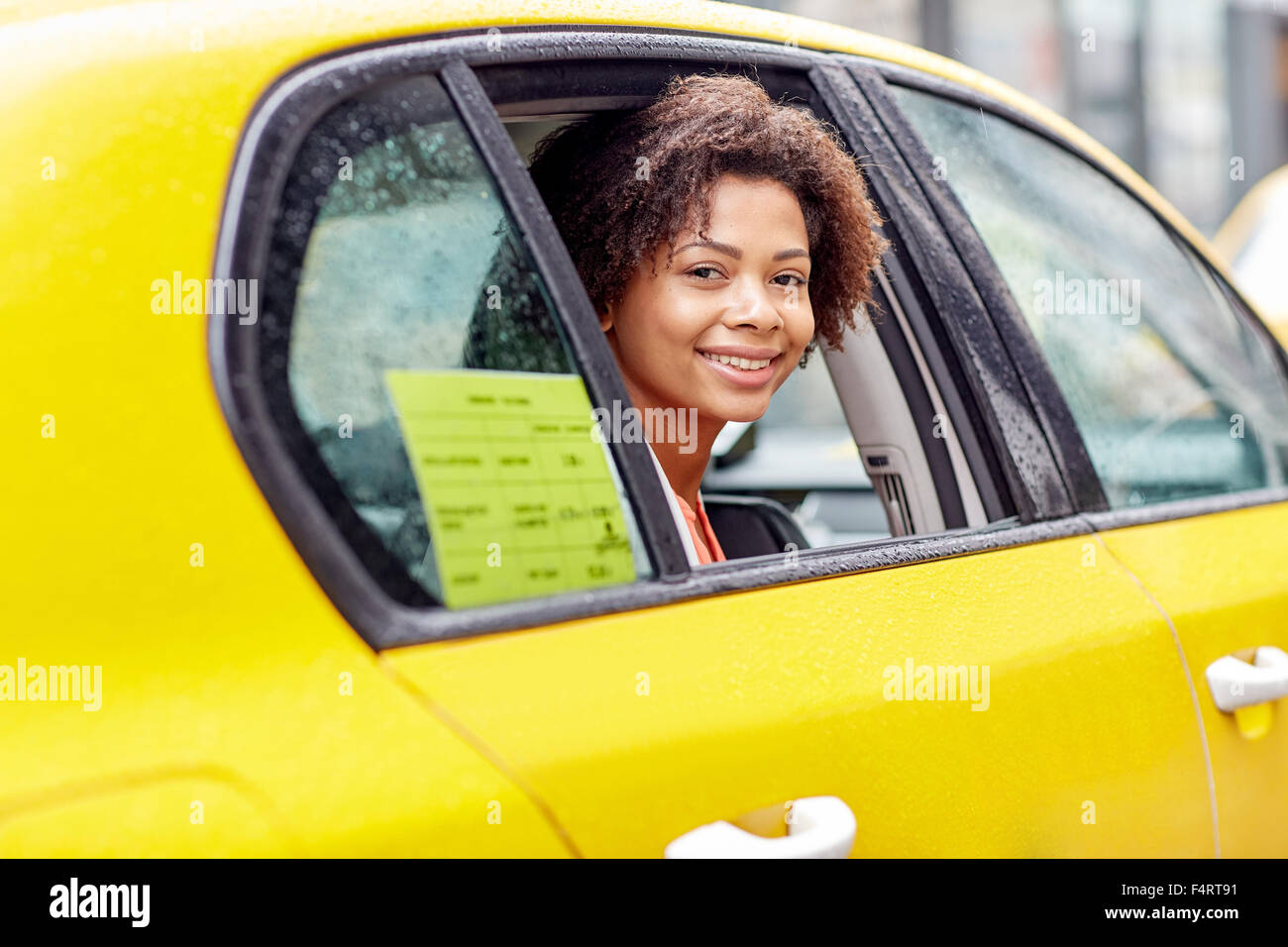 happy african american woman driving in taxi Stock Photo - Alamy
