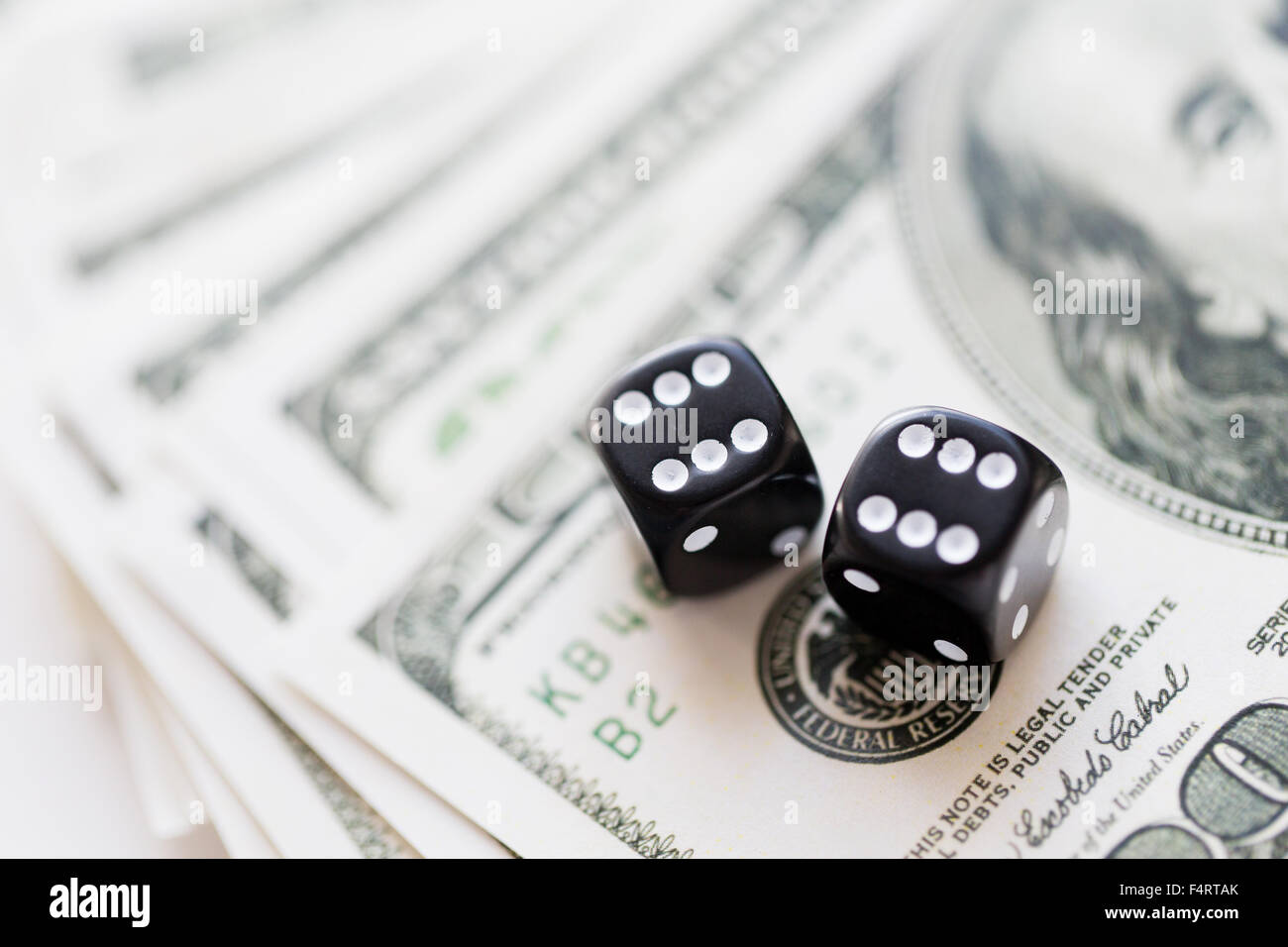 close up of black dice and dollar cash money Stock Photo - Alamy