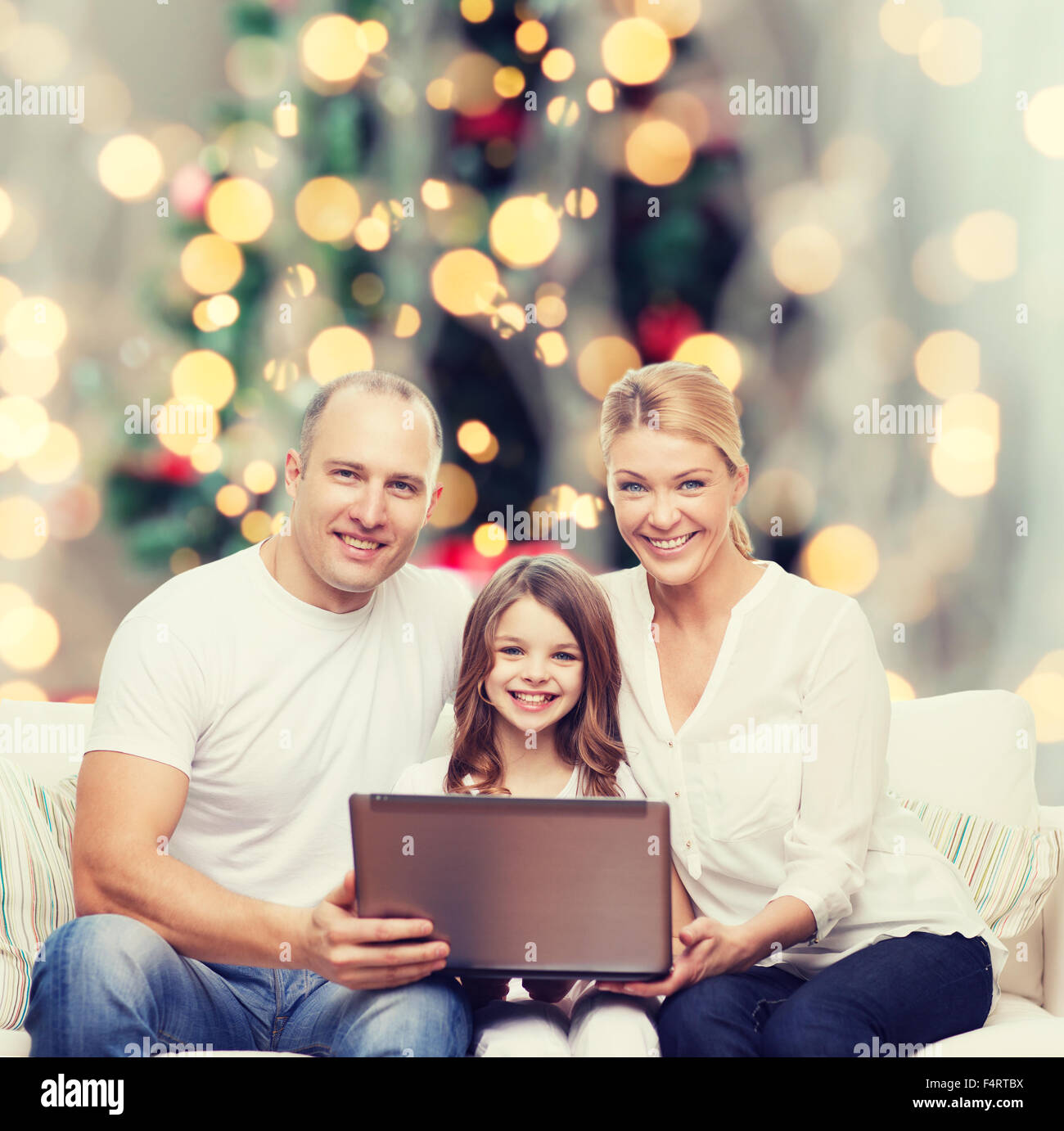 smiling family with laptop Stock Photo - Alamy