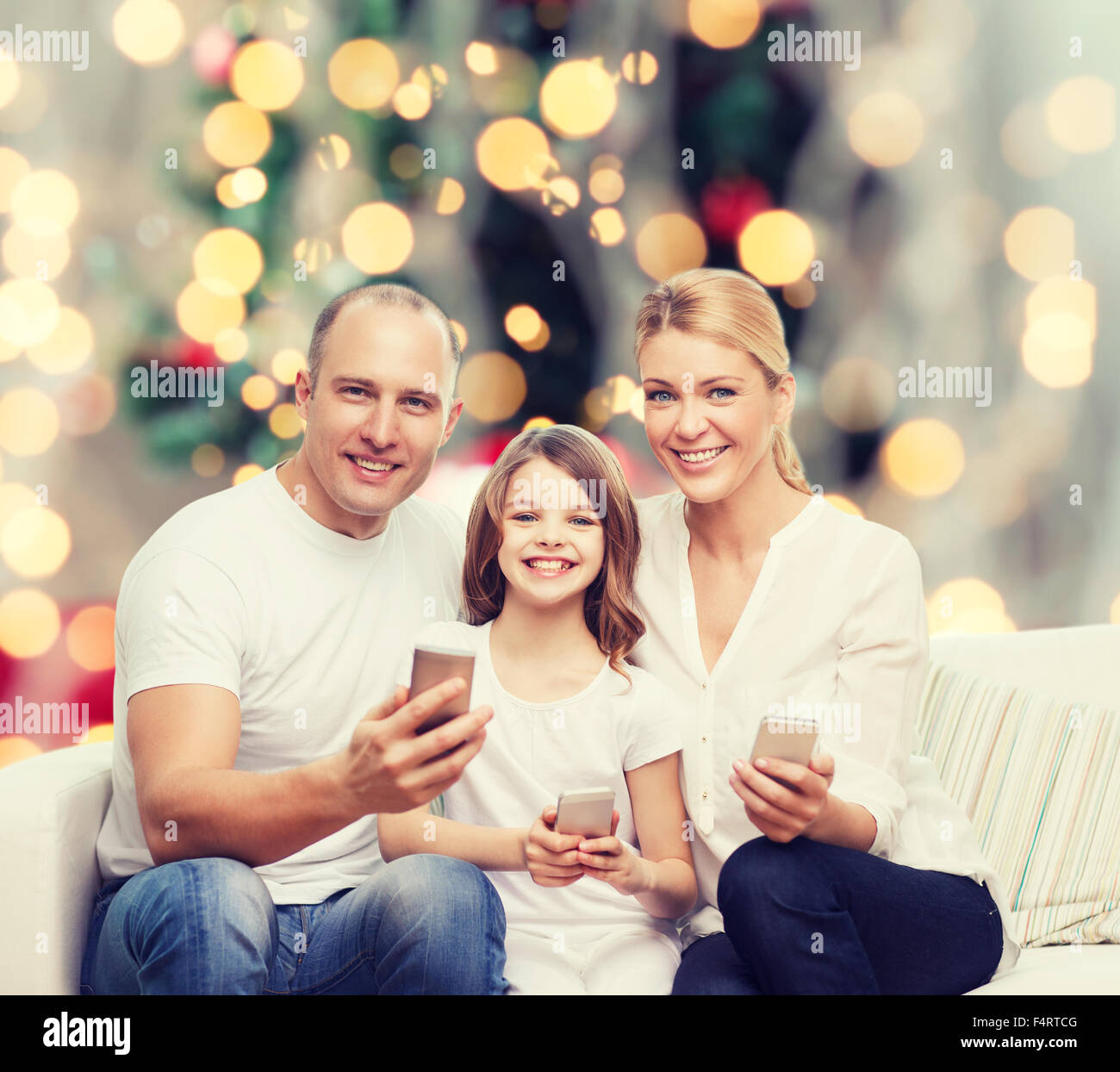 happy family with smartphones Stock Photo - Alamy