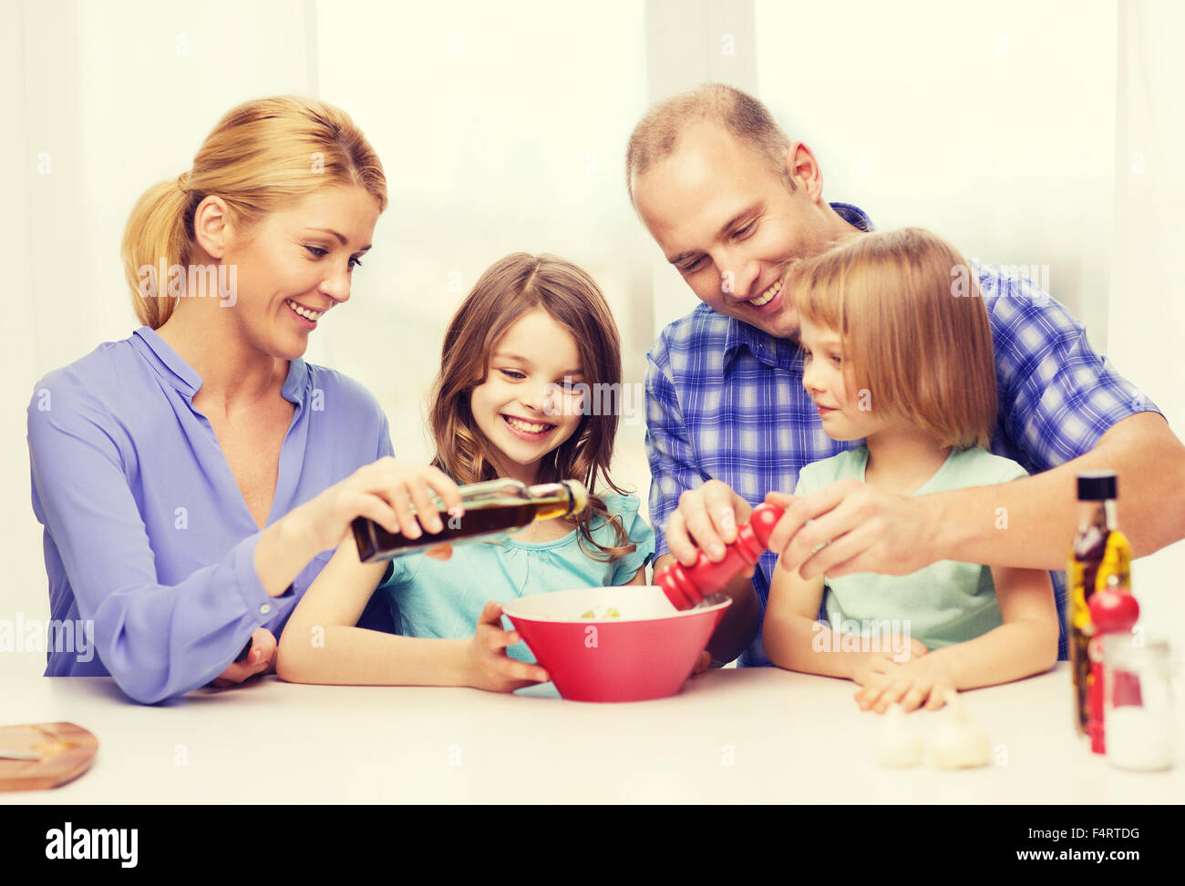 Family with children eating home hi-res stock photography and images ...