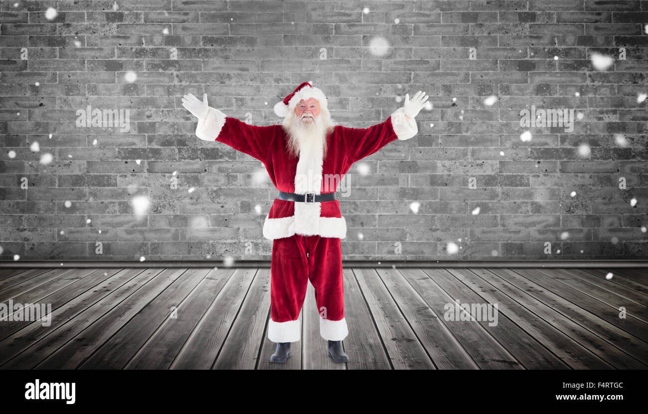 Composite image of santa with arms out Stock Photo - Alamy