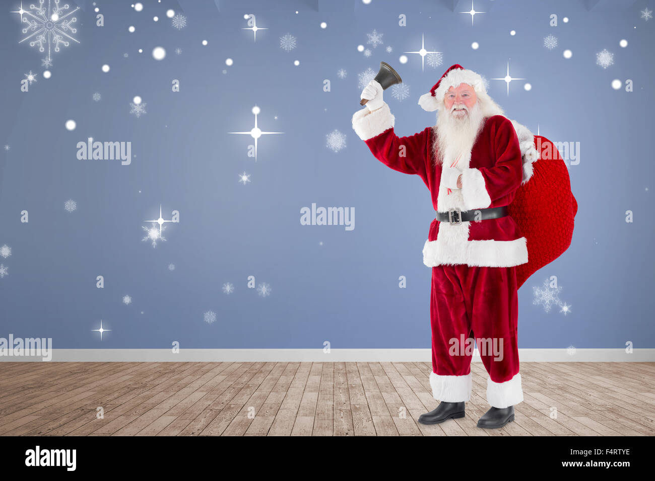 Composite image of santa ringing his bell Stock Photo - Alamy