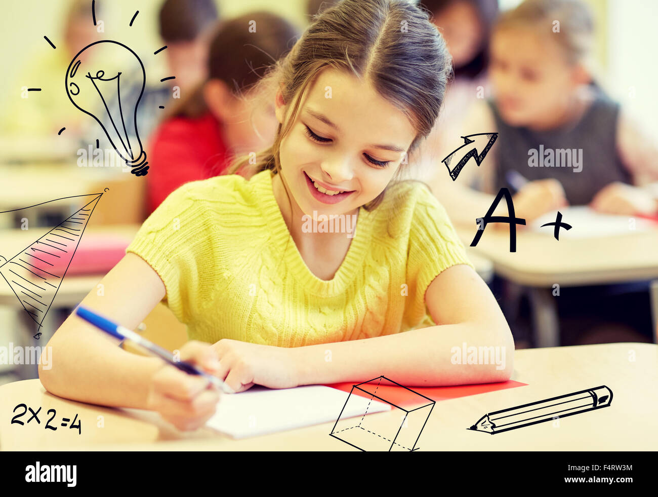 group of school kids writing test in classroom Stock Photo - Alamy