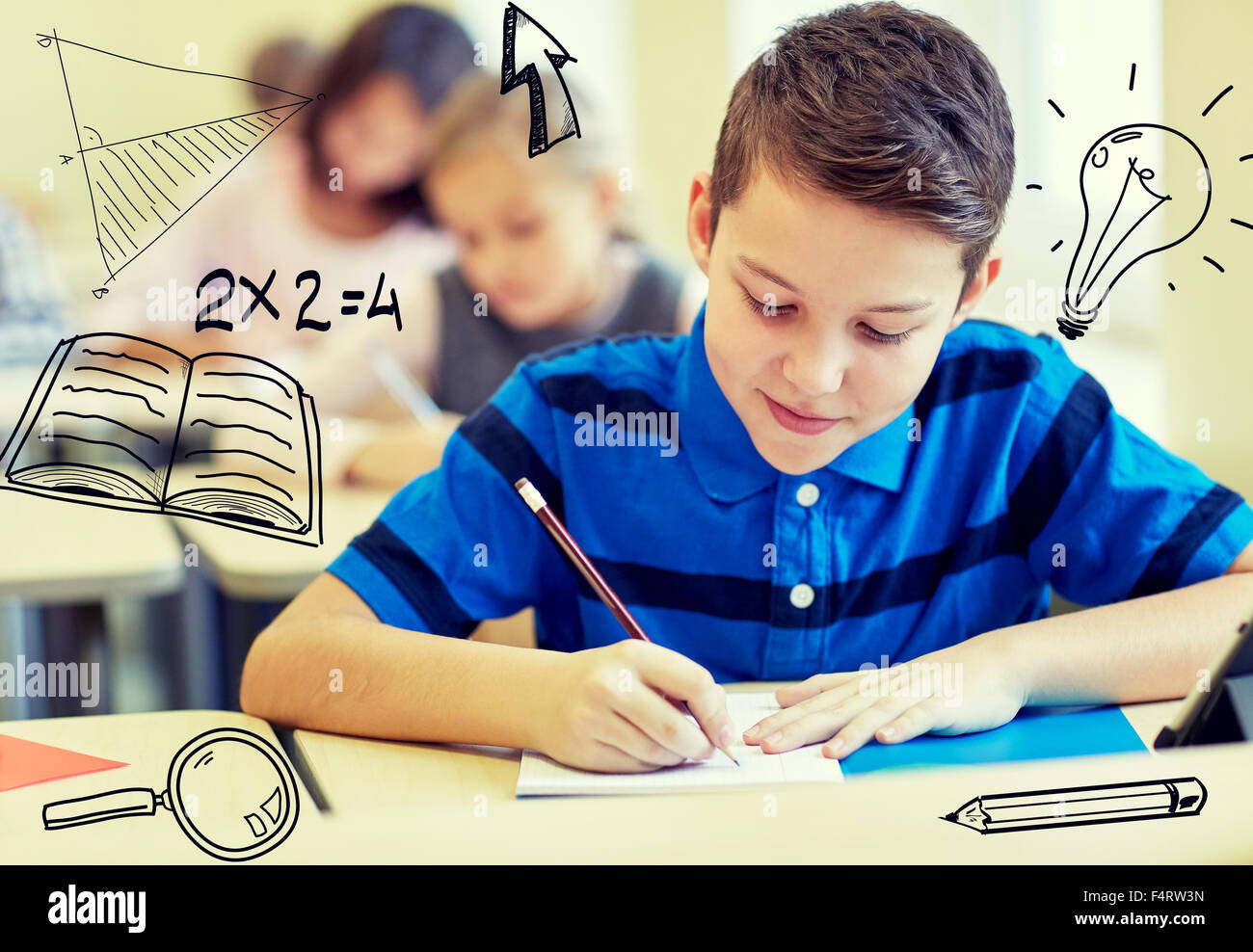 group of school kids writing test in classroom Stock Photo - Alamy