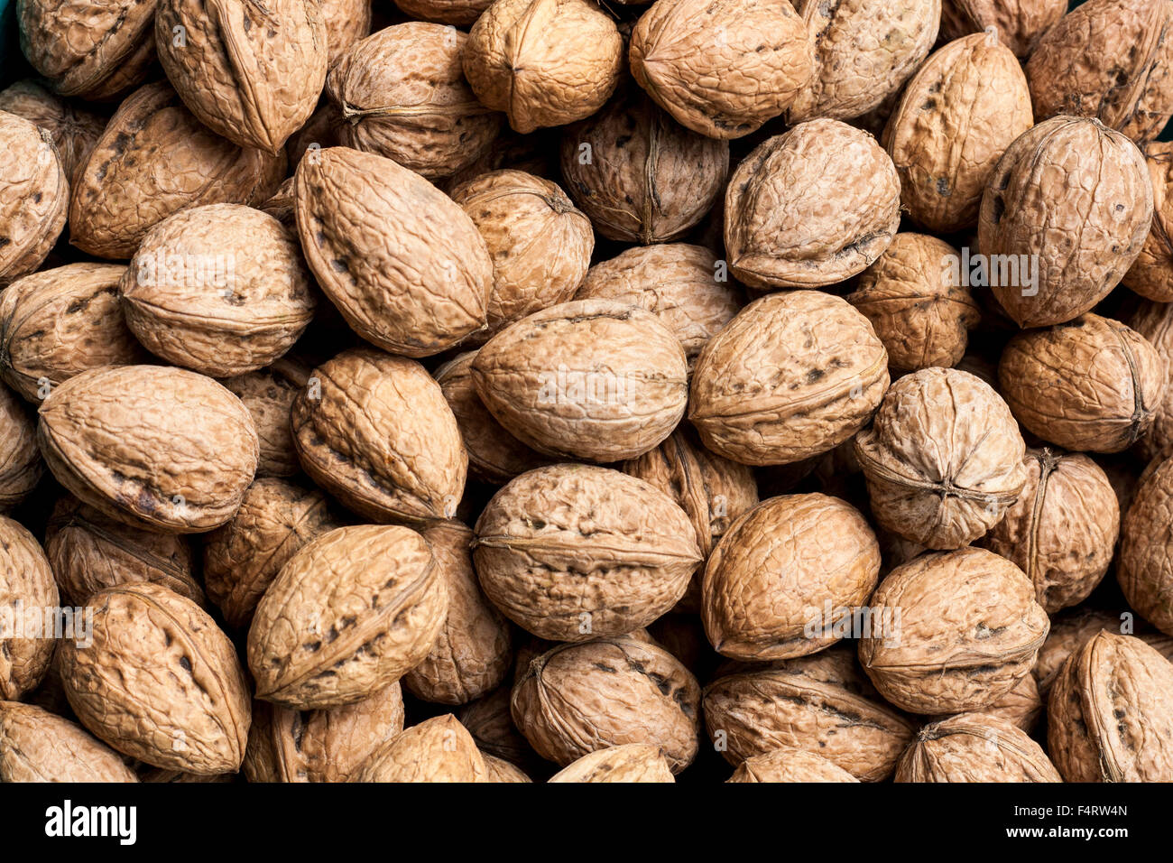 Background from whole ripe walnuts, close up Stock Photo - Alamy