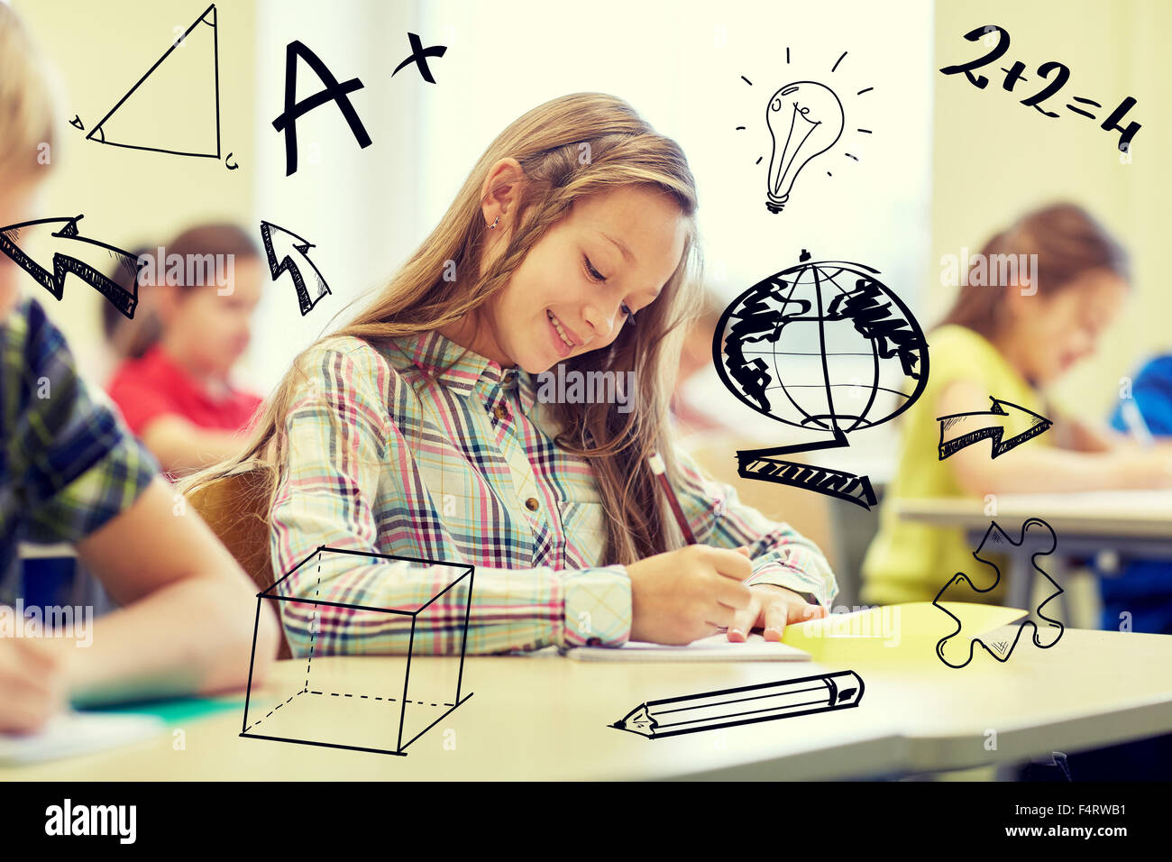 group of school kids writing test in classroom Stock Photo - Alamy