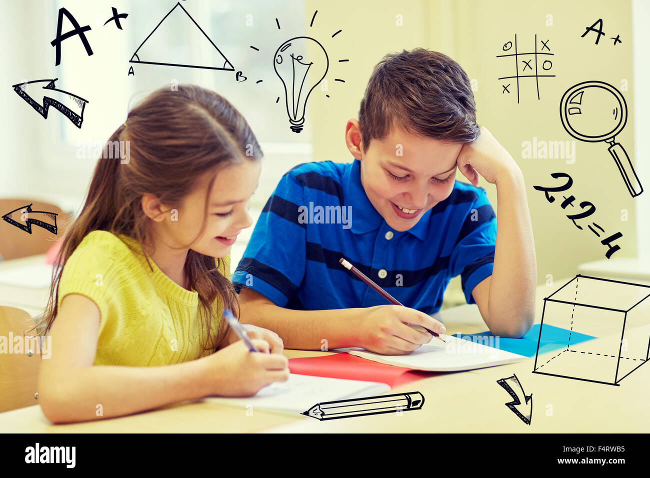 group of school kids writing test in classroom Stock Photo - Alamy
