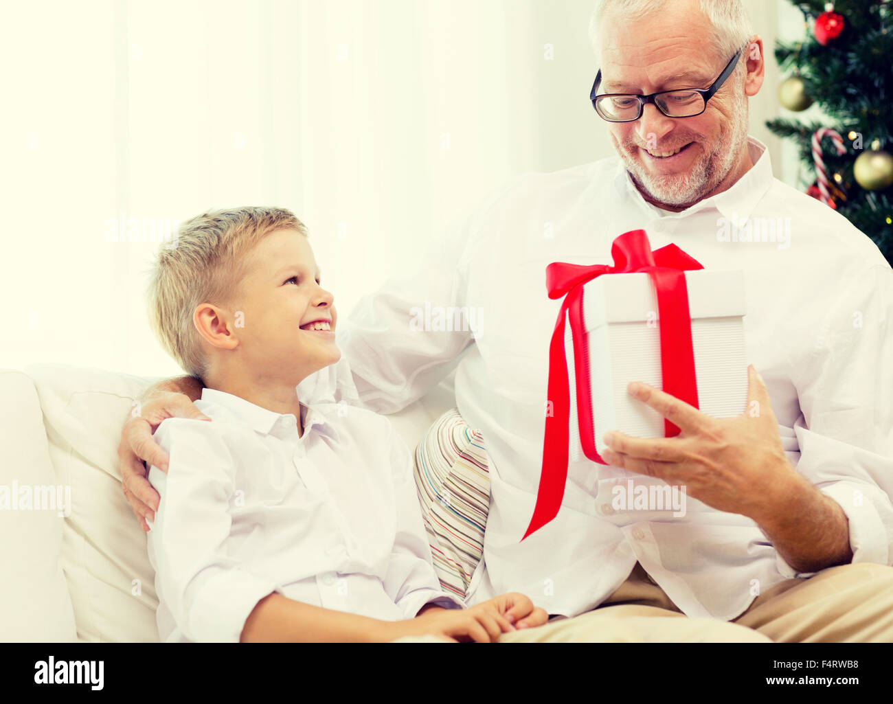 smiling grandfather and grandson at home Stock Photo - Alamy