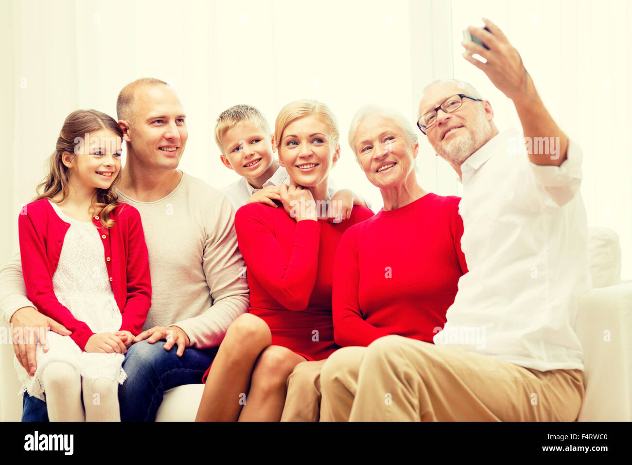 smiling family with camera at home Stock Photo - Alamy