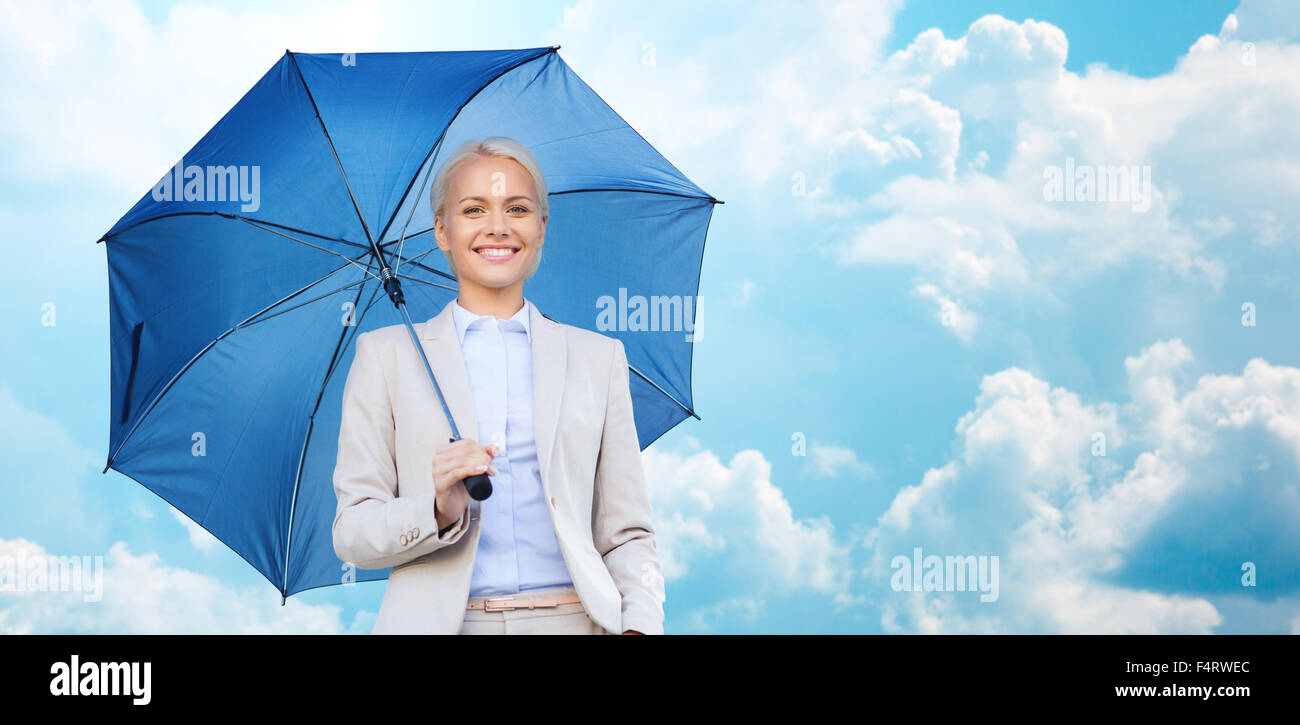 Walking smiling woman umbrella hi-res stock photography and images - Alamy