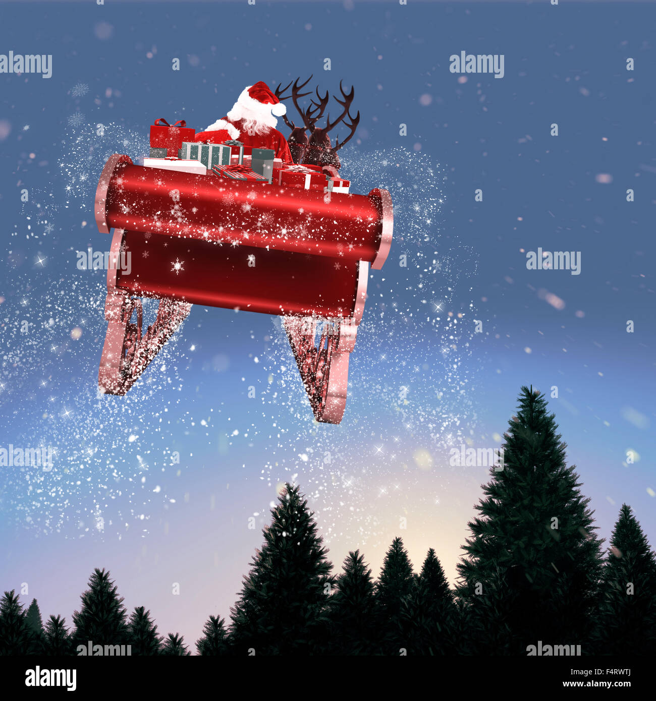 Composite image of santa flying his sleigh Stock Photo - Alamy