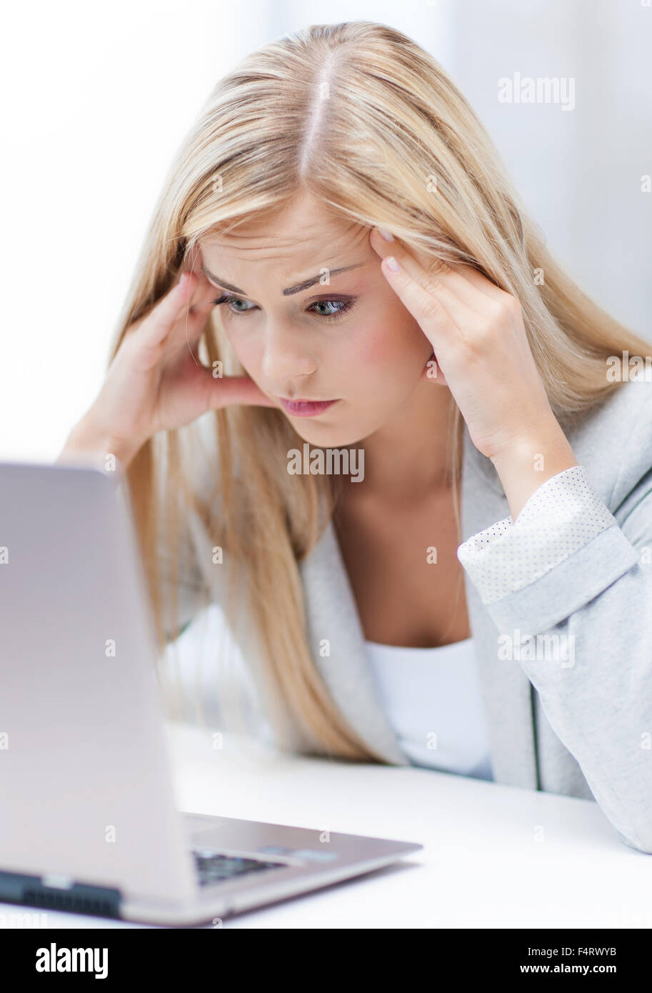 stressed woman with laptop Stock Photo - Alamy