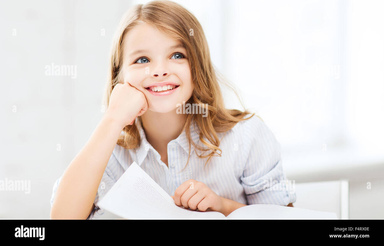 little student girl studying at school Stock Photo - Alamy