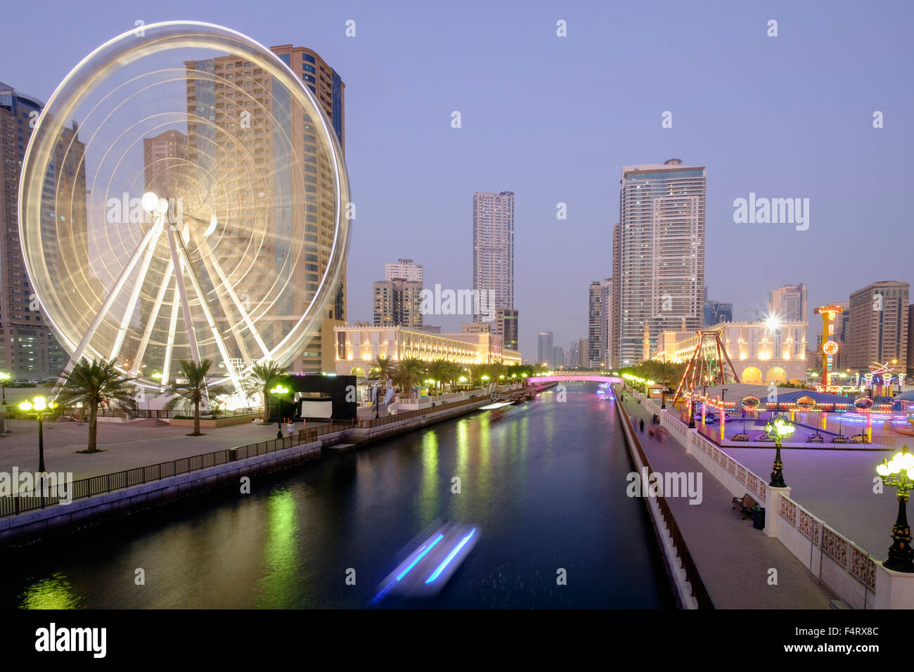 Evening view of Eye of the Emirates ferris wheel and Al Qasba ...