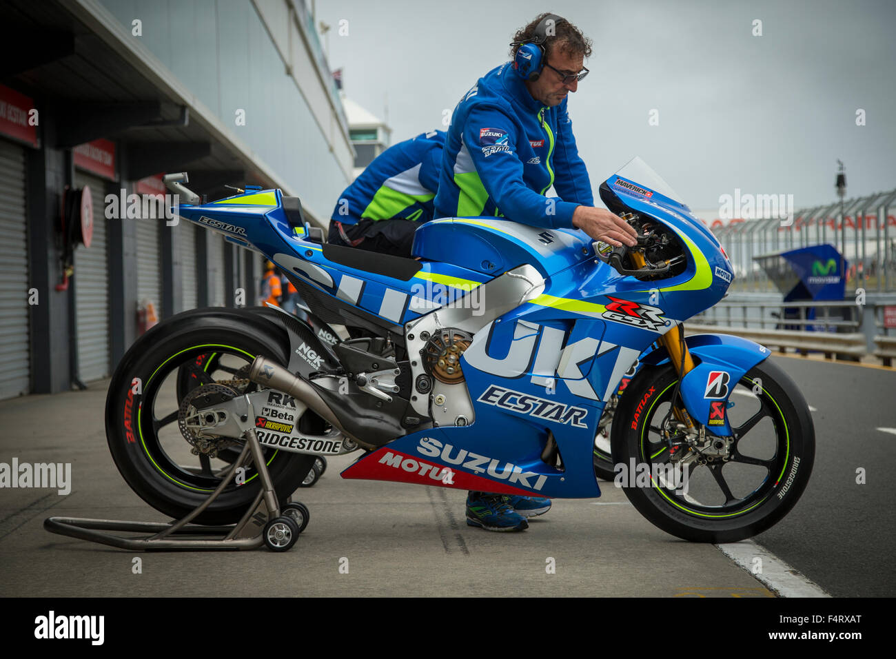 Mechanics prep the Team ECSTAR Suzuki MotoGP motorcycles prior to the ...