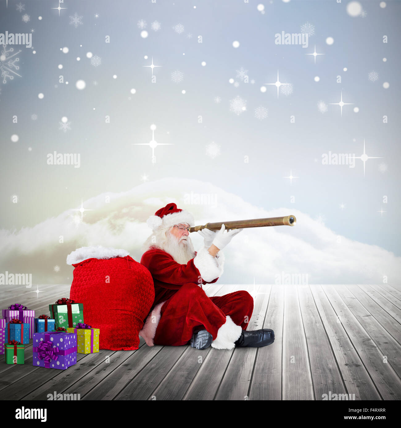 Composite image of santa looking through telescope Stock Photo - Alamy