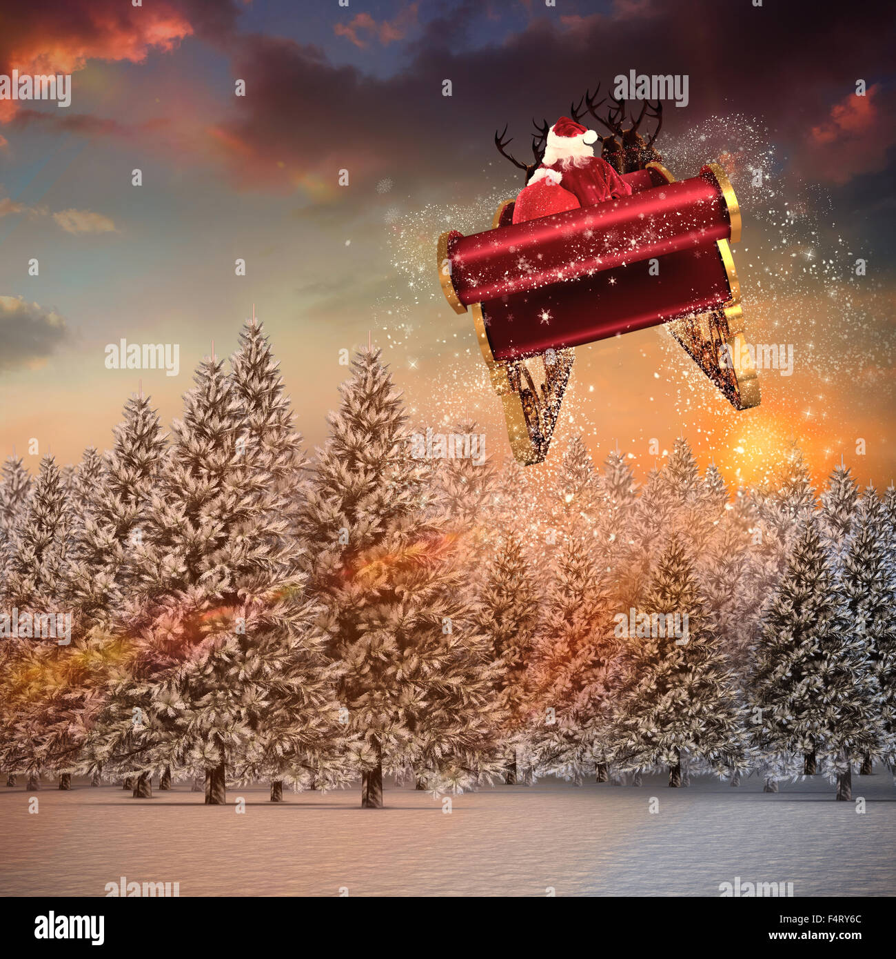 Composite image of santa flying his sleigh Stock Photo - Alamy