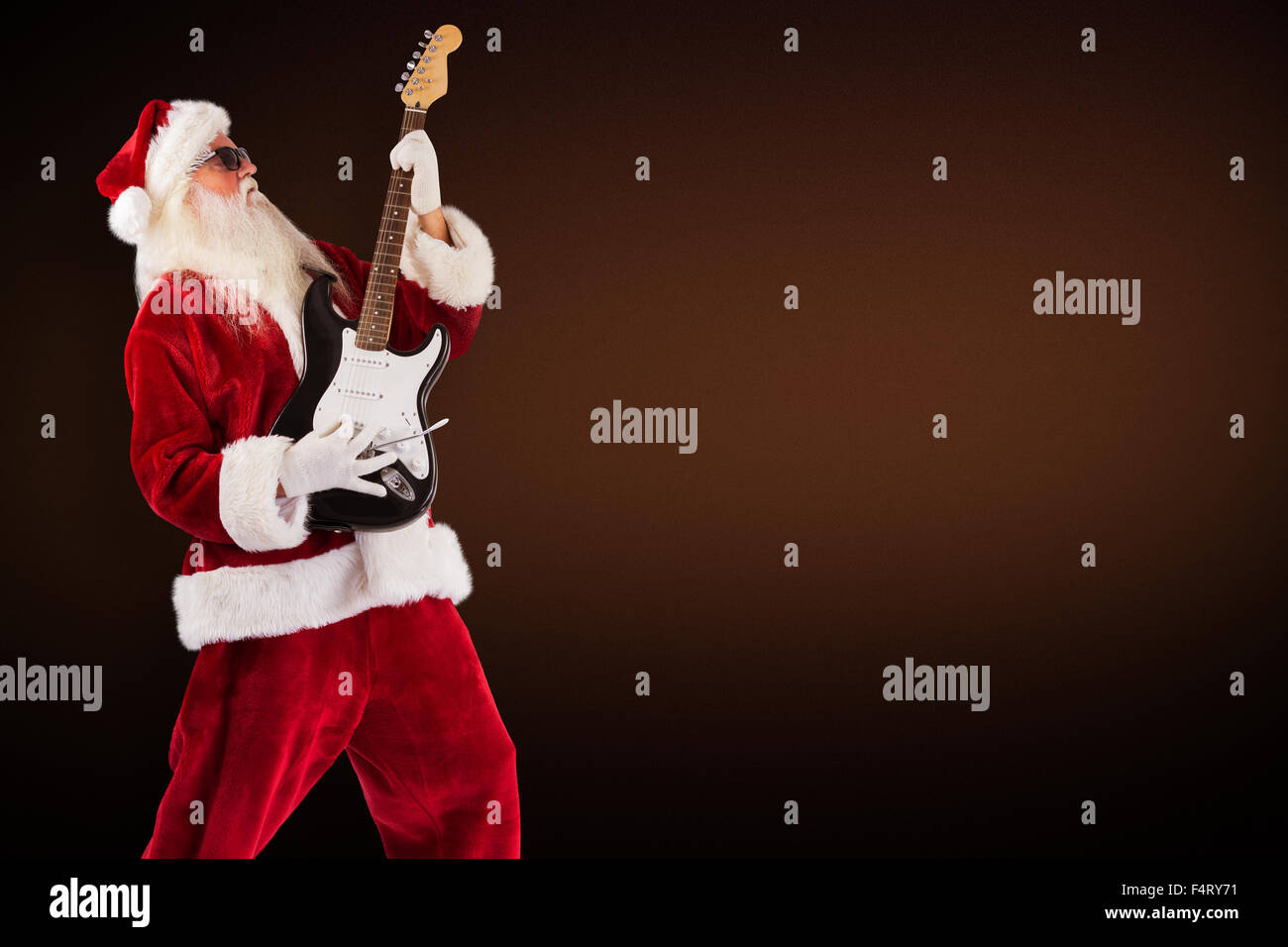 Happy santa playing electric guitar hi-res stock photography and images ...