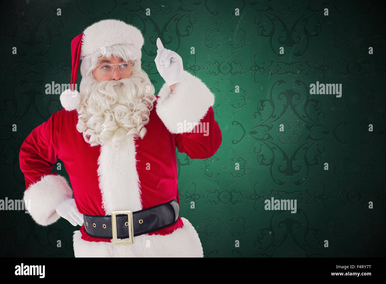Composite image of serious santa claus pointing his finger Stock Photo ...