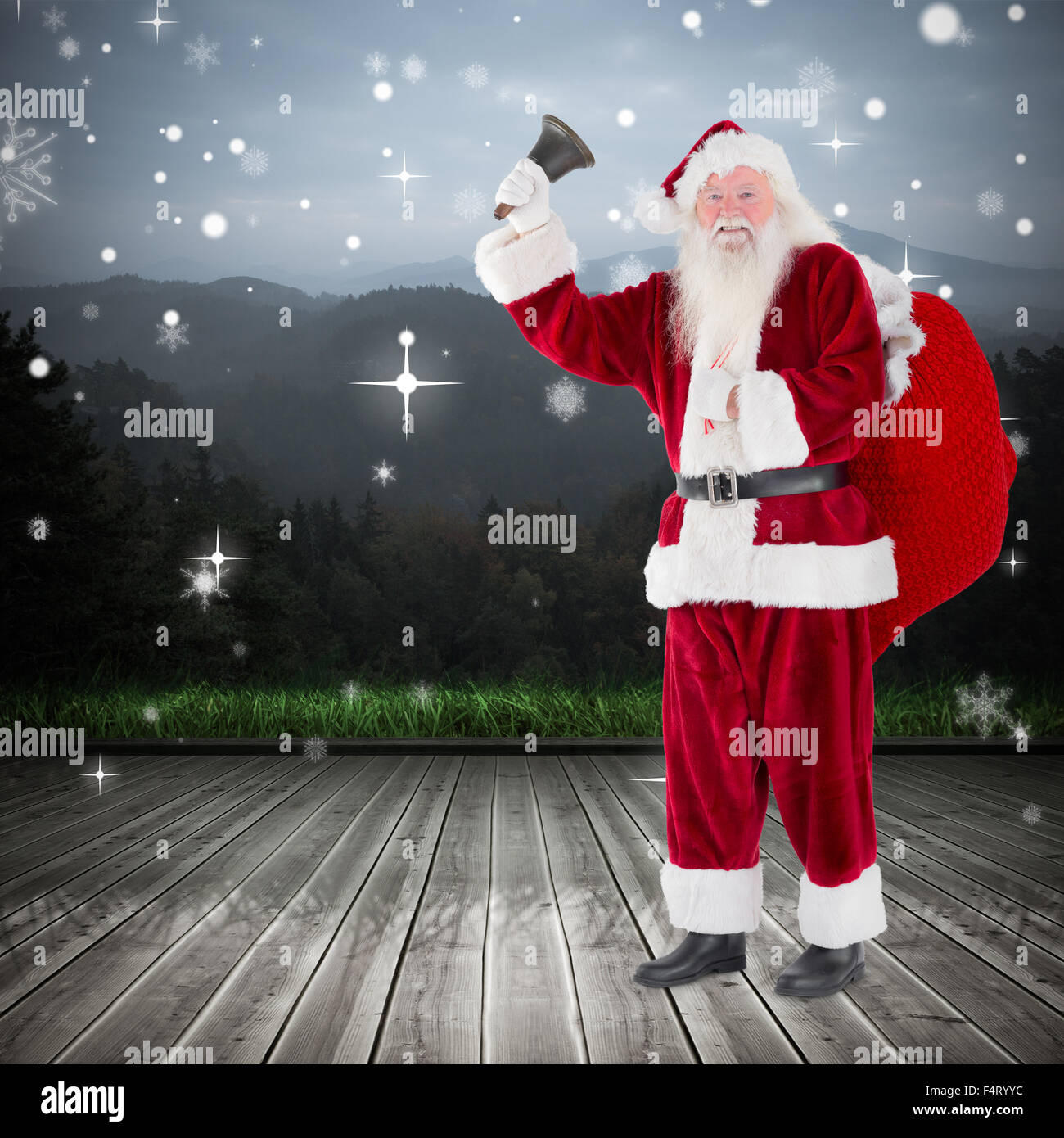 Composite image of santa ringing his bell Stock Photo - Alamy