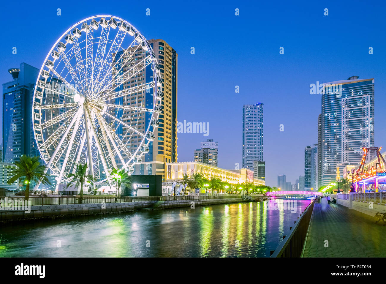 Evening view of Eye of the Emirates ferris wheel and Al Qasba ...