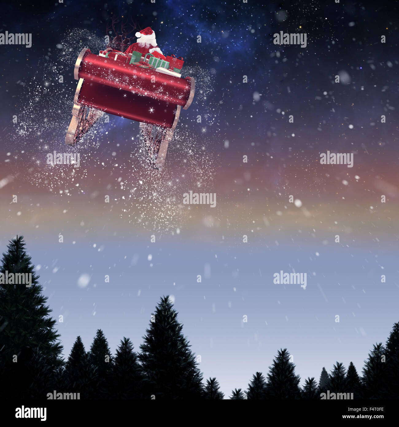 Composite image of santa flying his sleigh Stock Photo - Alamy