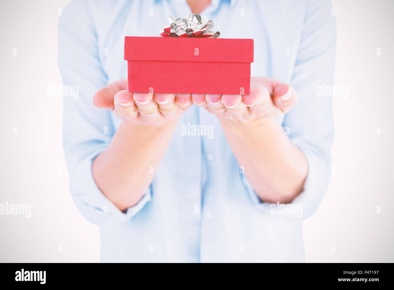 Composite image of womans hands presenting Stock Photo - Alamy