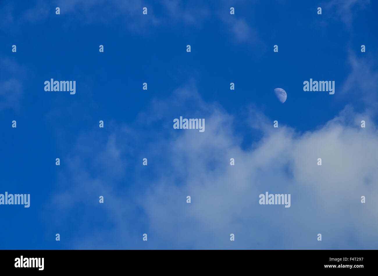 haft white moon in blue sky Stock Photo - Alamy