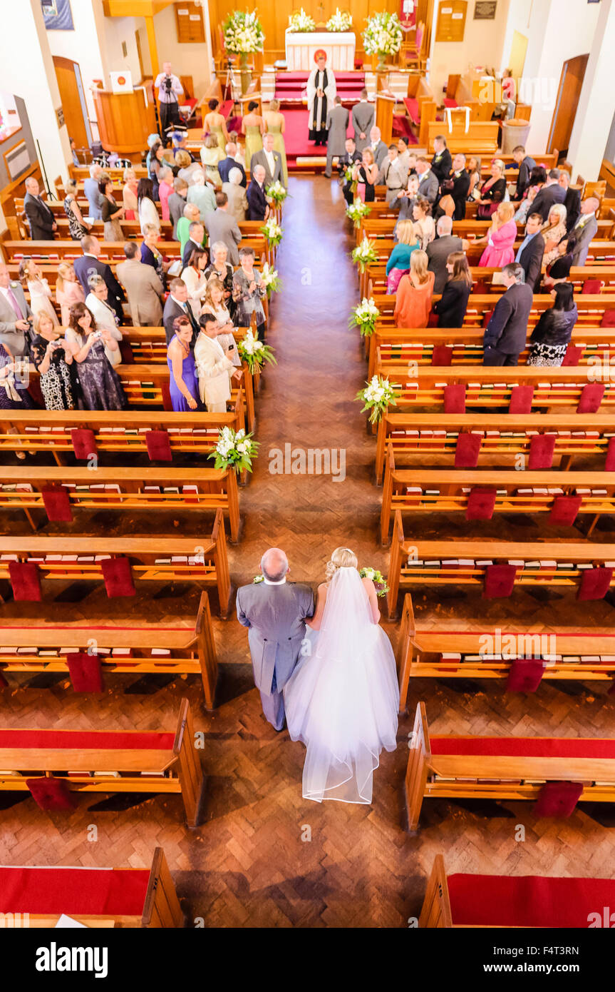 A father leads his daughter down the aisle at her wedding Stock Photo ...