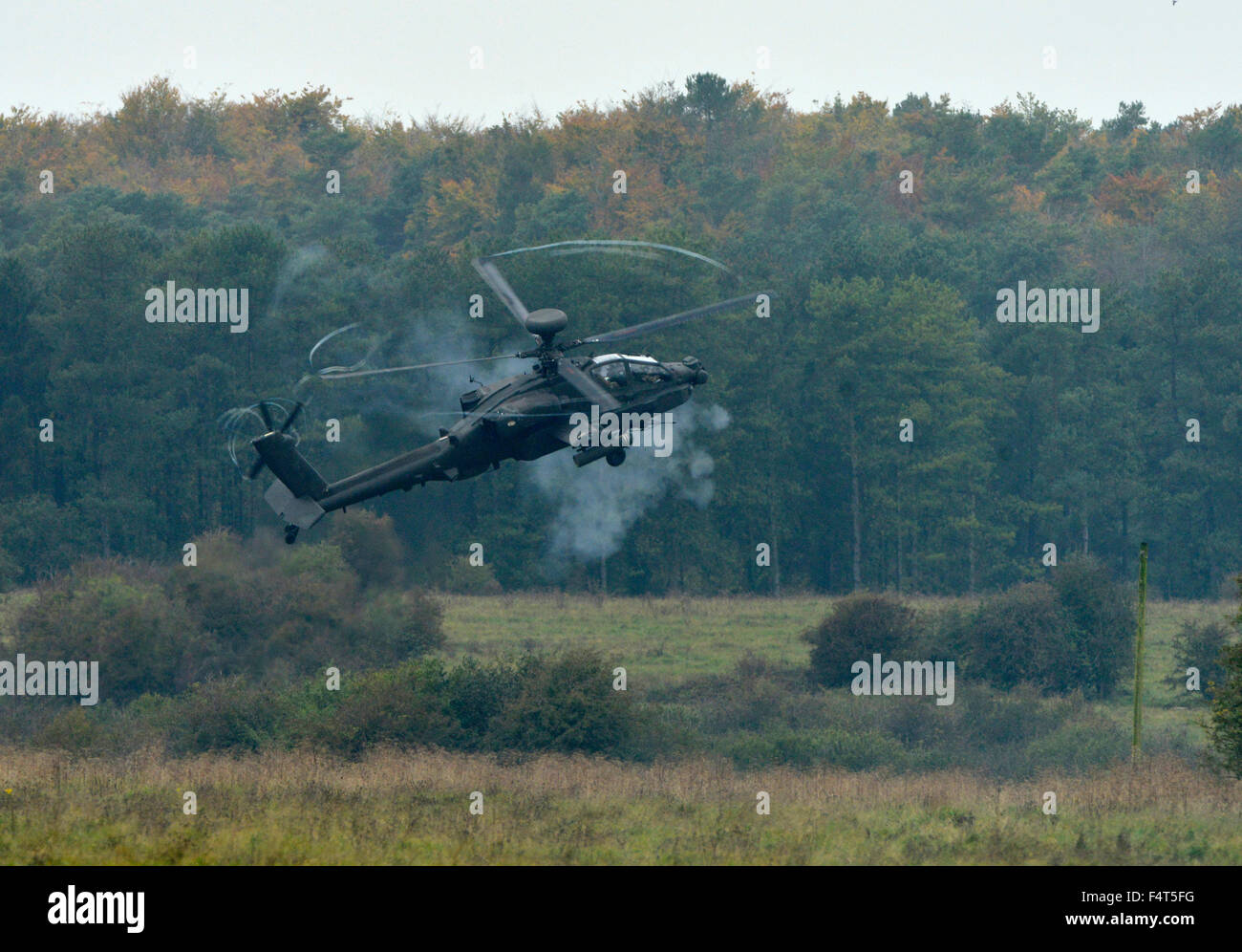 Apache helicopter gunship in action during British Army Fire Power ...