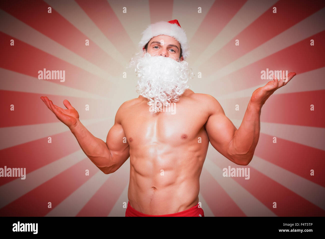 Composite image of portrait of shirtless macho man with fake santa ...