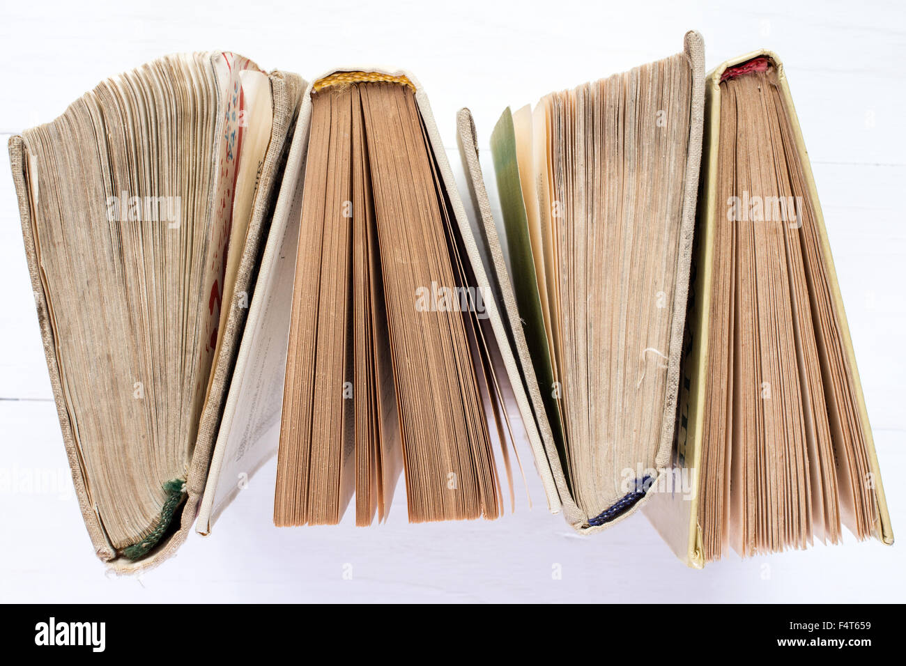Top view of four hardback books in a row. Education background Stock ...