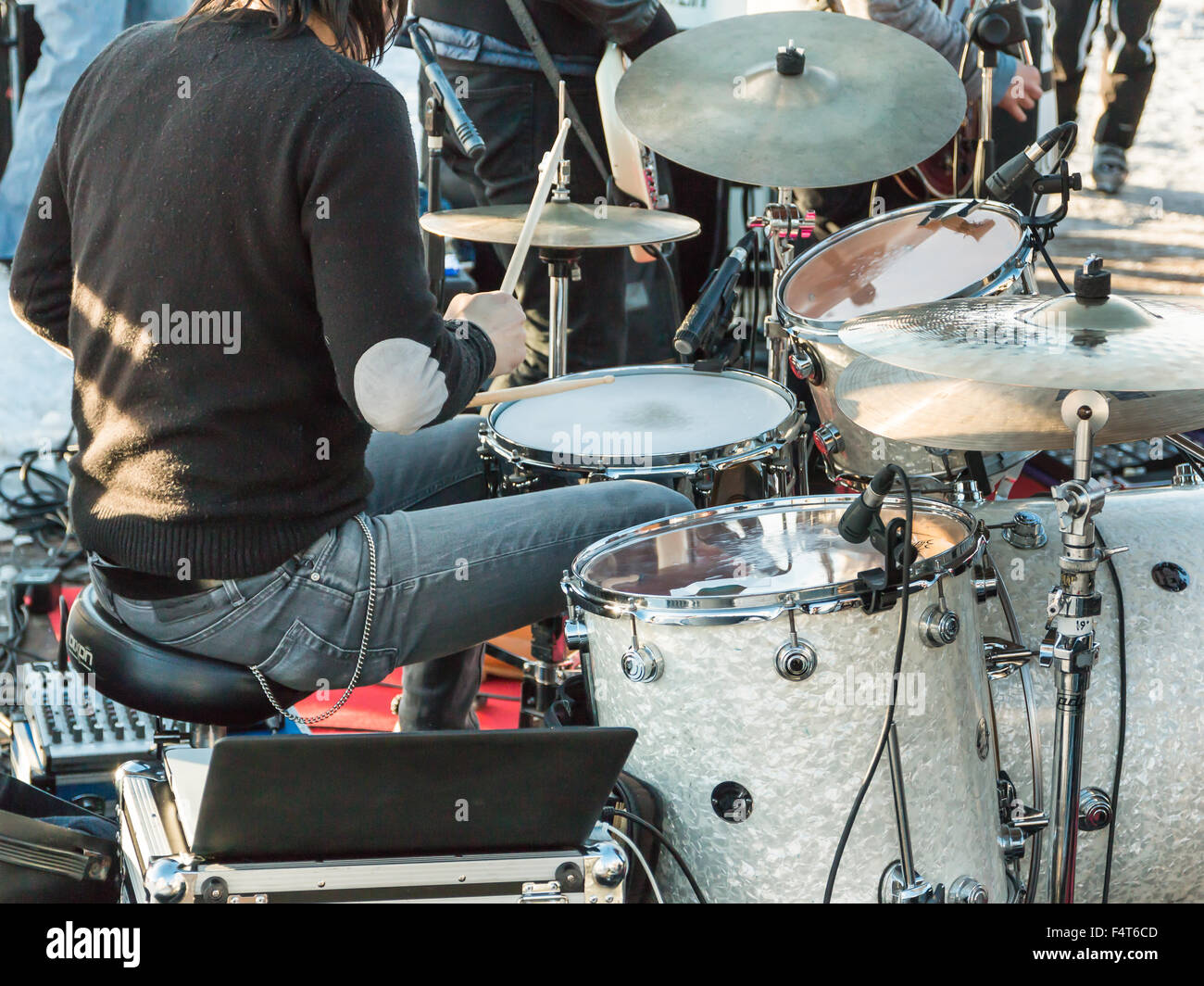 black hair drummer during outdoor concert: rear view Stock Photo - Alamy