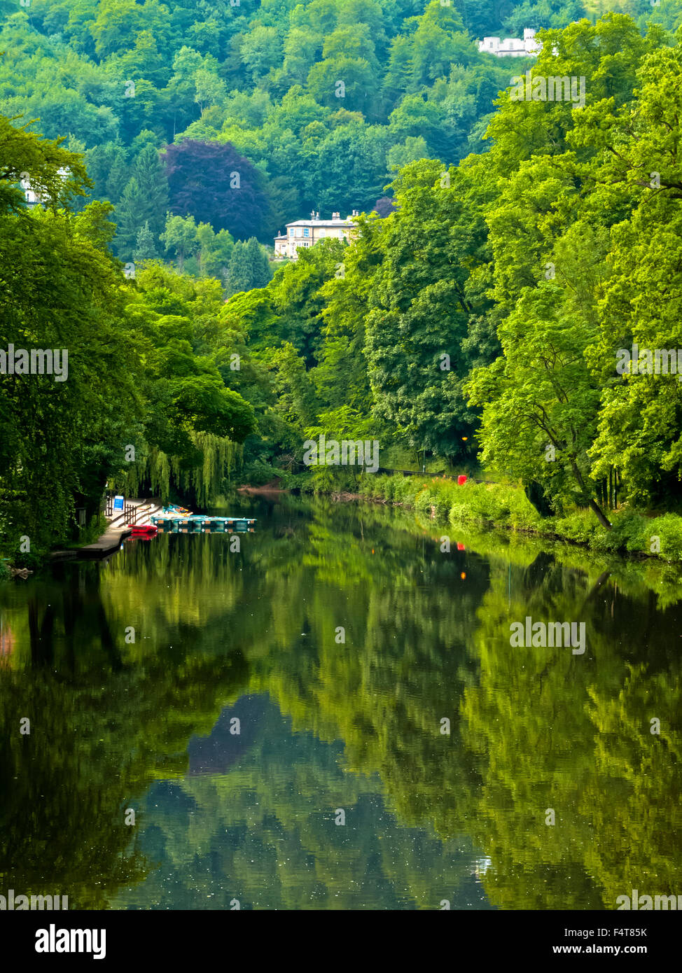 Calm water in the River Derwent in summer at Matlock Bath a popular ...