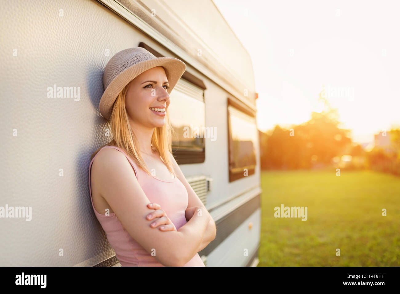 Beautiful woman outside the camper van Stock Photo - Alamy