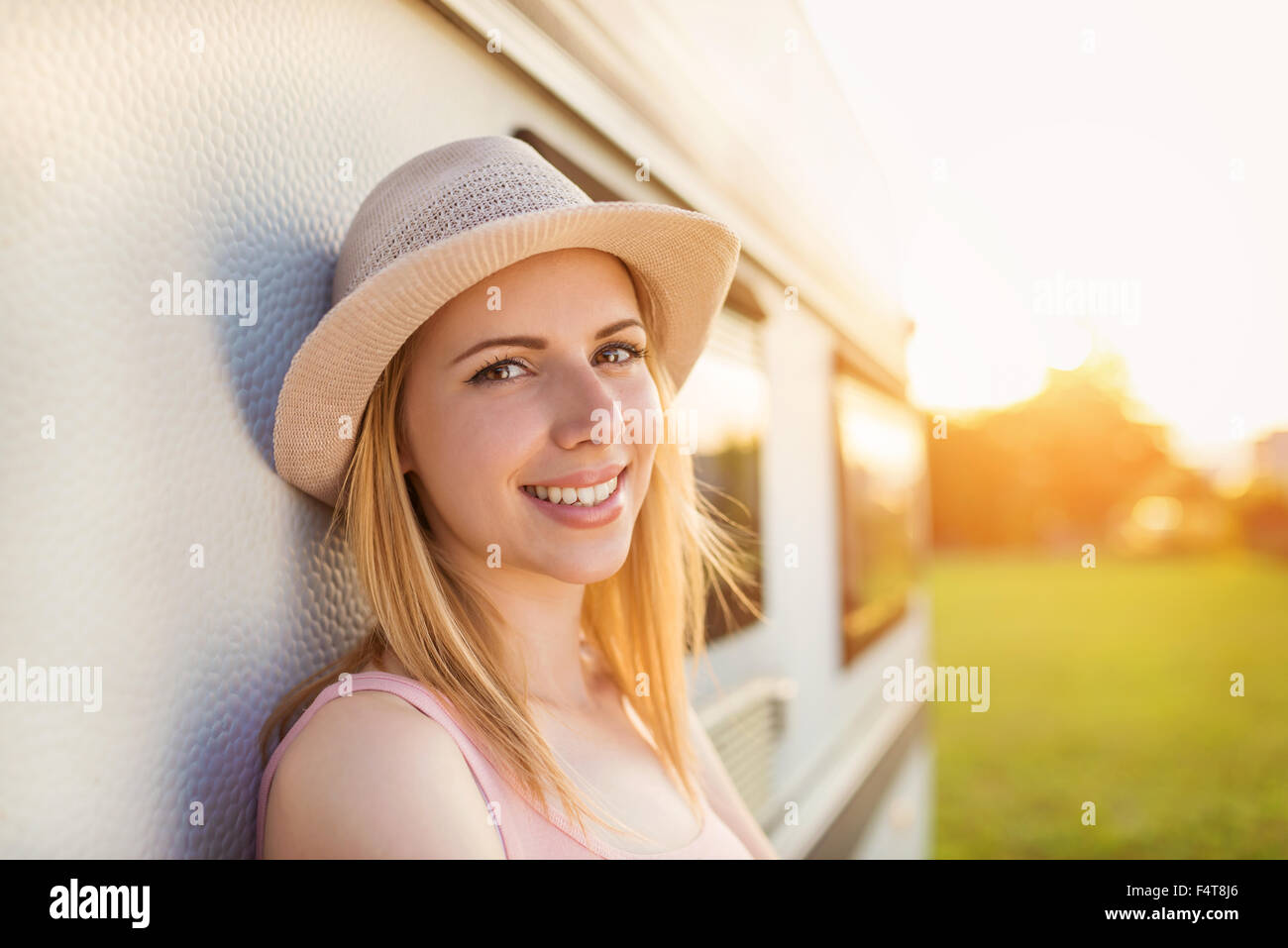Beautiful woman outside the camper van Stock Photo - Alamy