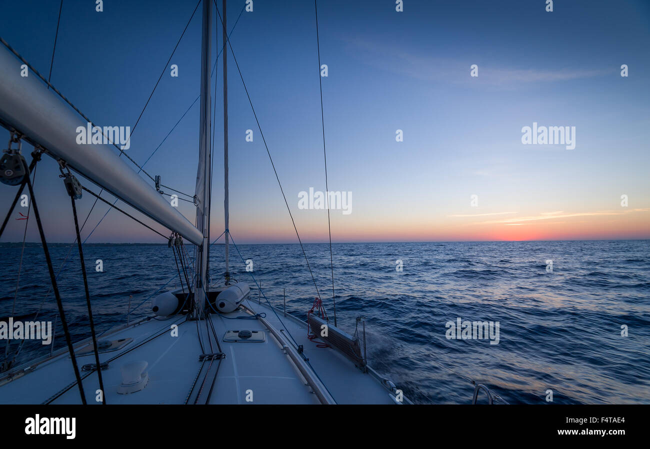 Sailing at sunset Stock Photo - Alamy