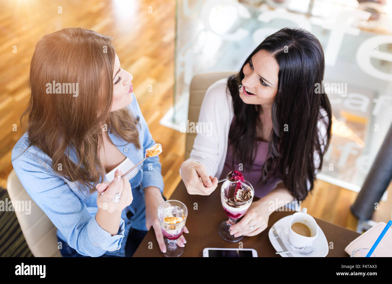 Beautiful women in cafe Stock Photo - Alamy