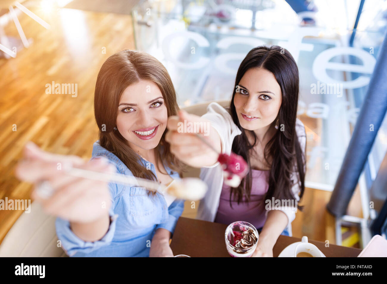 Beautiful women in cafe Stock Photo - Alamy