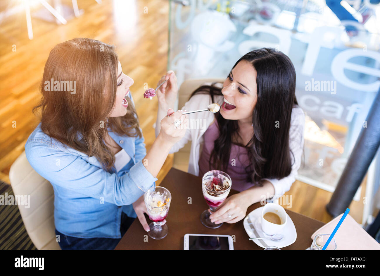 Beautiful women in cafe Stock Photo - Alamy