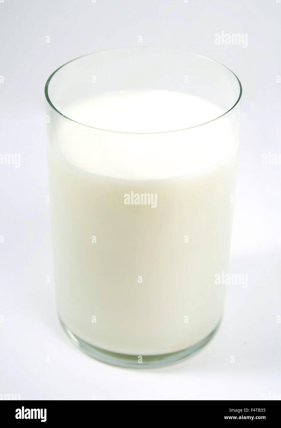 Glass of fresh milk on a bright background Stock Photo - Alamy