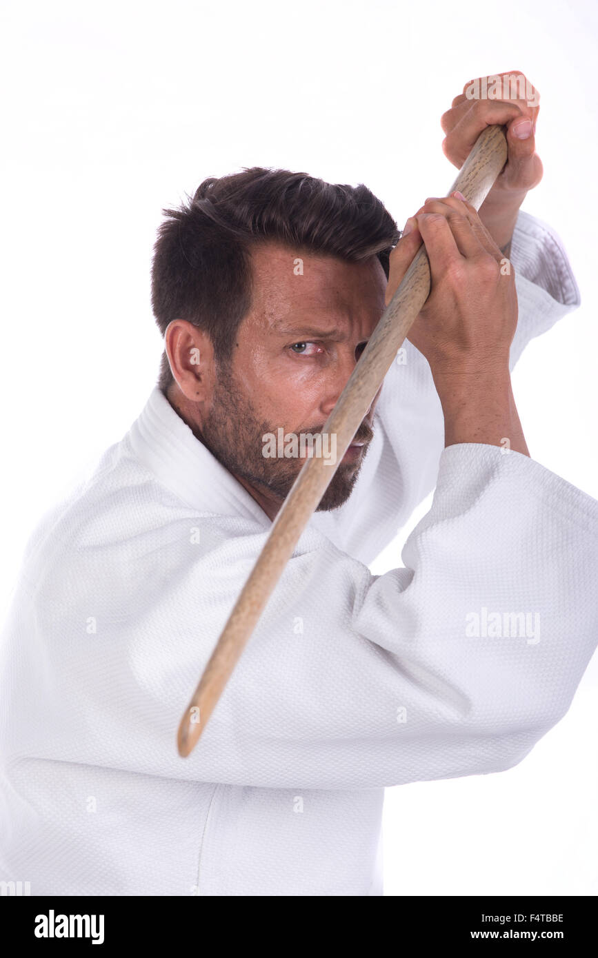 aikido master with wood sword in defensive position Stock Photo - Alamy