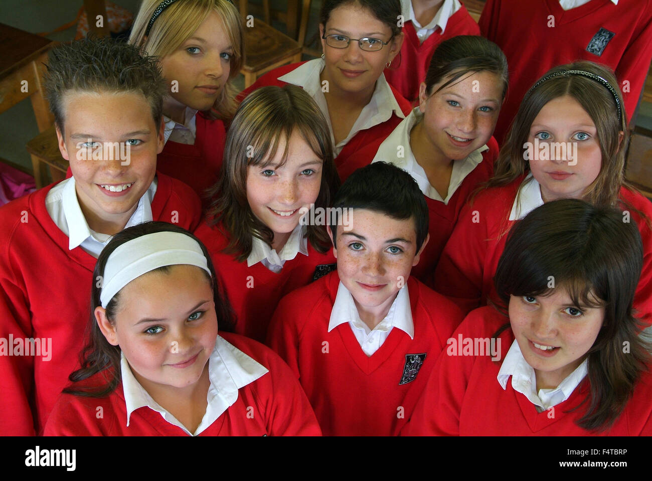 Female students in a classroom, wearing red uniforms at Lakers ...