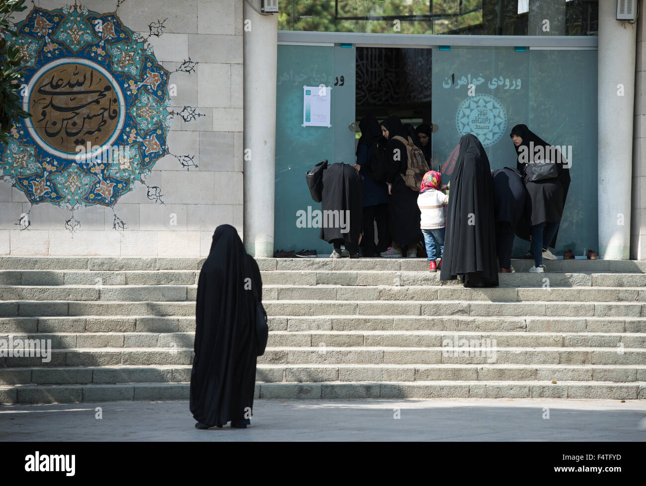 Tehran, Iran. 18th Oct, 2015. Female students walk across the campus of ...