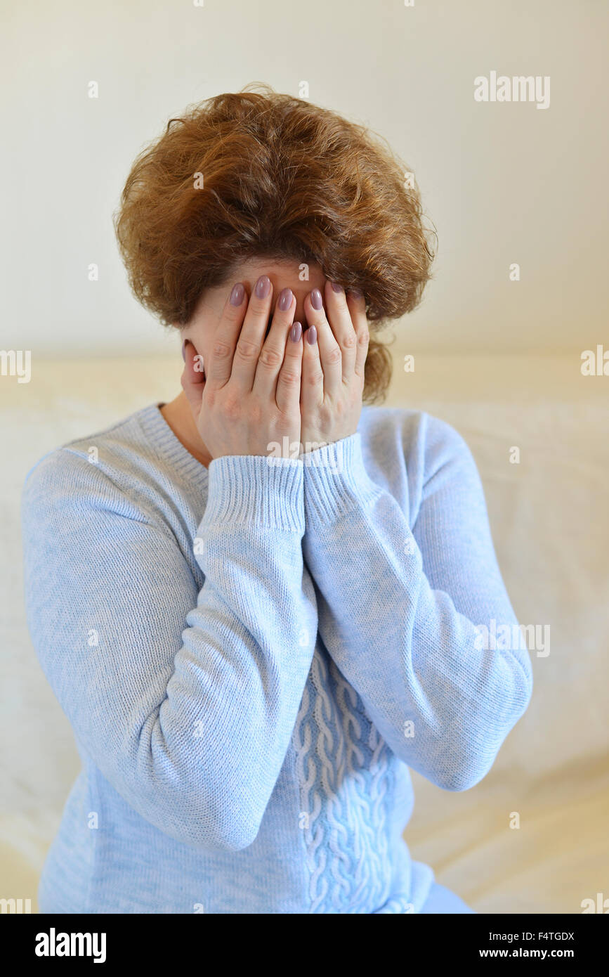 frustrated woman covering her face with hands Stock Photo - Alamy