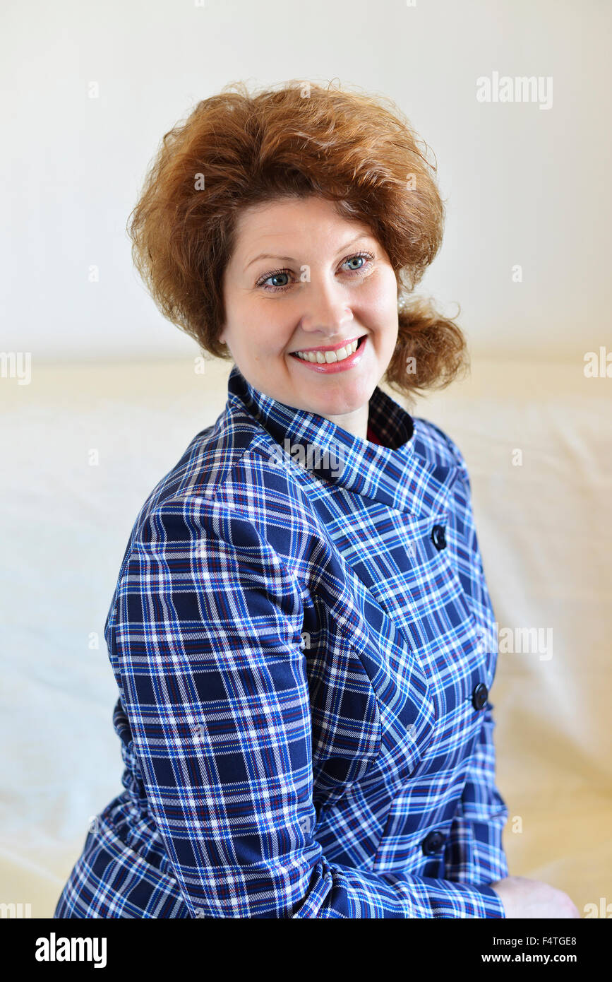 Portrait of adult female on a light background Stock Photo - Alamy