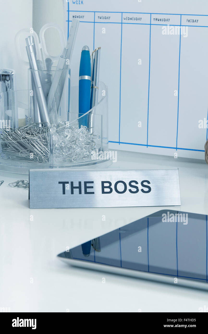 Home and Business office interior set up with a THE BOSS name plate and ...