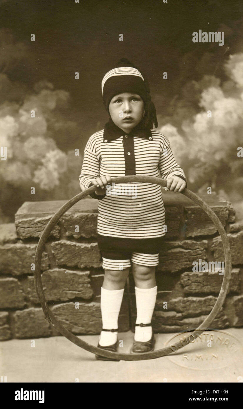 Child with striped dress and circle Stock Photo - Alamy