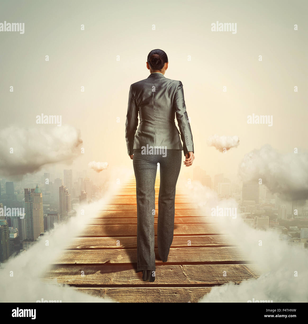 Woman walking to the light Stock Photo - Alamy